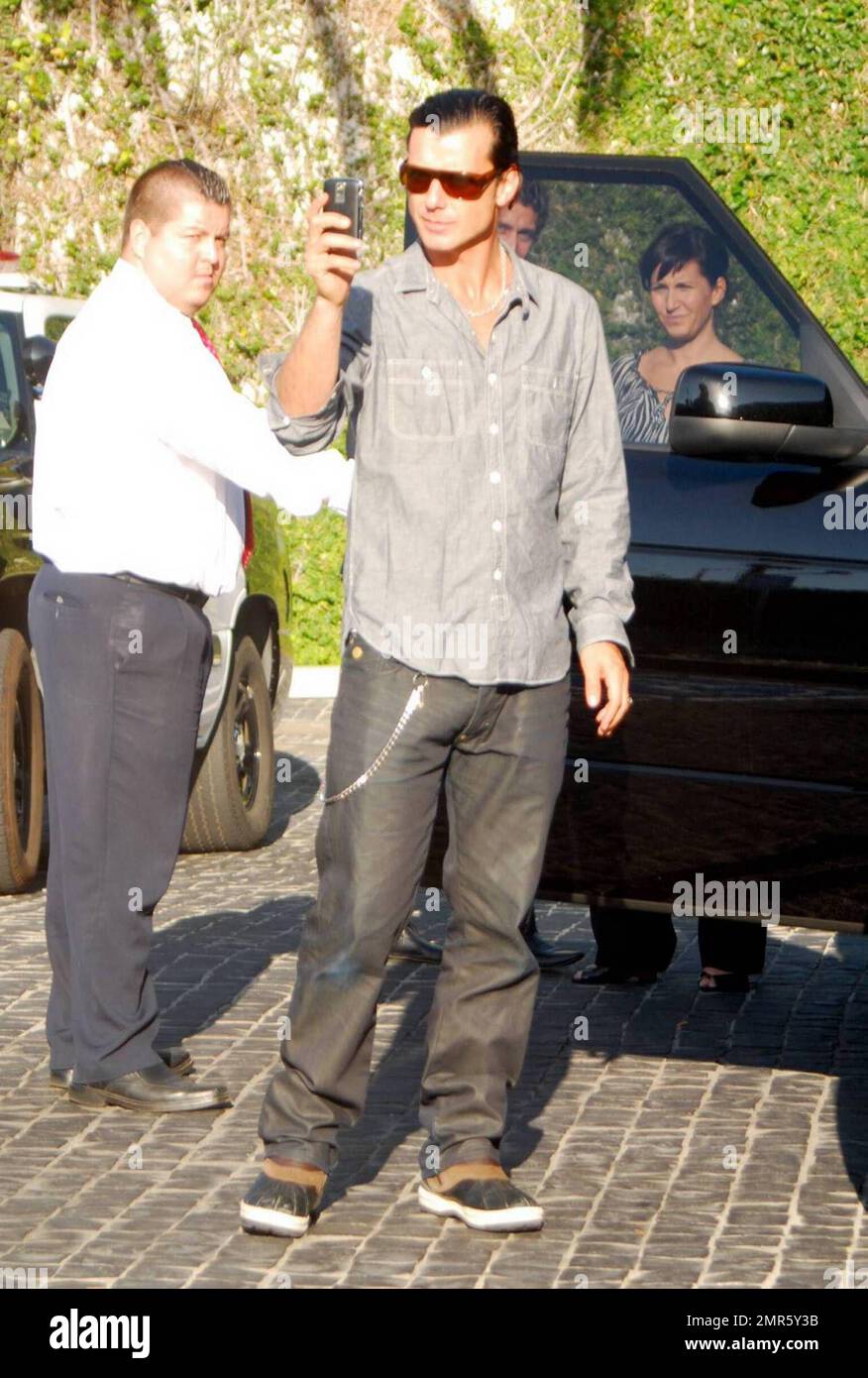 Gavin Rossdale takes some photos with his cellphone camera after making ...