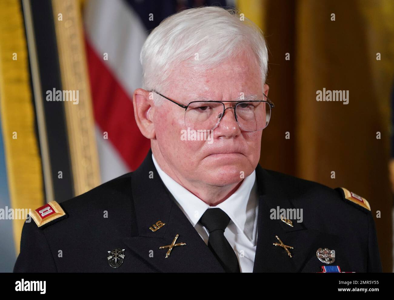 Retired Army Capt. Gary M. Rose, listens to President Donald Trump ...