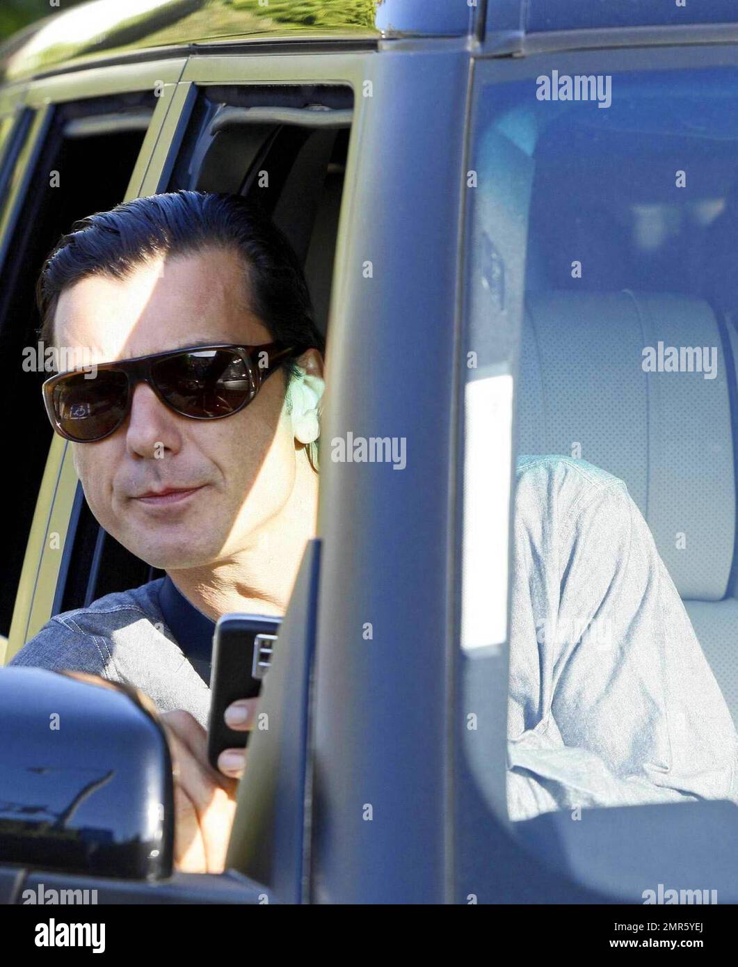 No Doubt singer Gwen Stefani waves to the cameras as she leaves her ...
