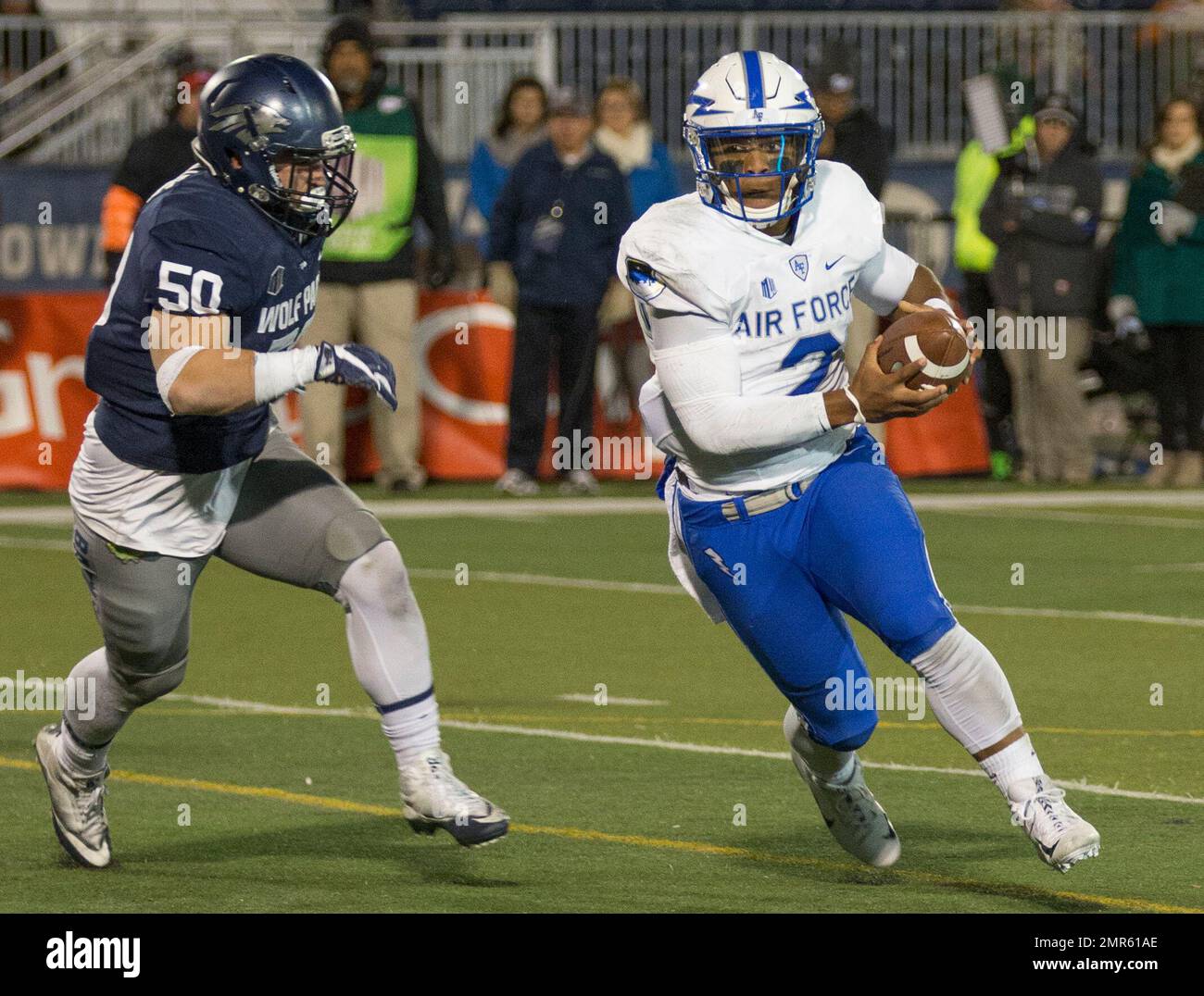 Air Force quarterback Arion Worthman (2), right, runs away from Nevada ...