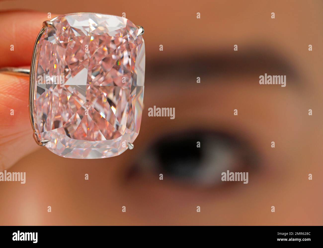 A 37.30 carat diamond "The Raj Pink" is displayed by a model at a ...