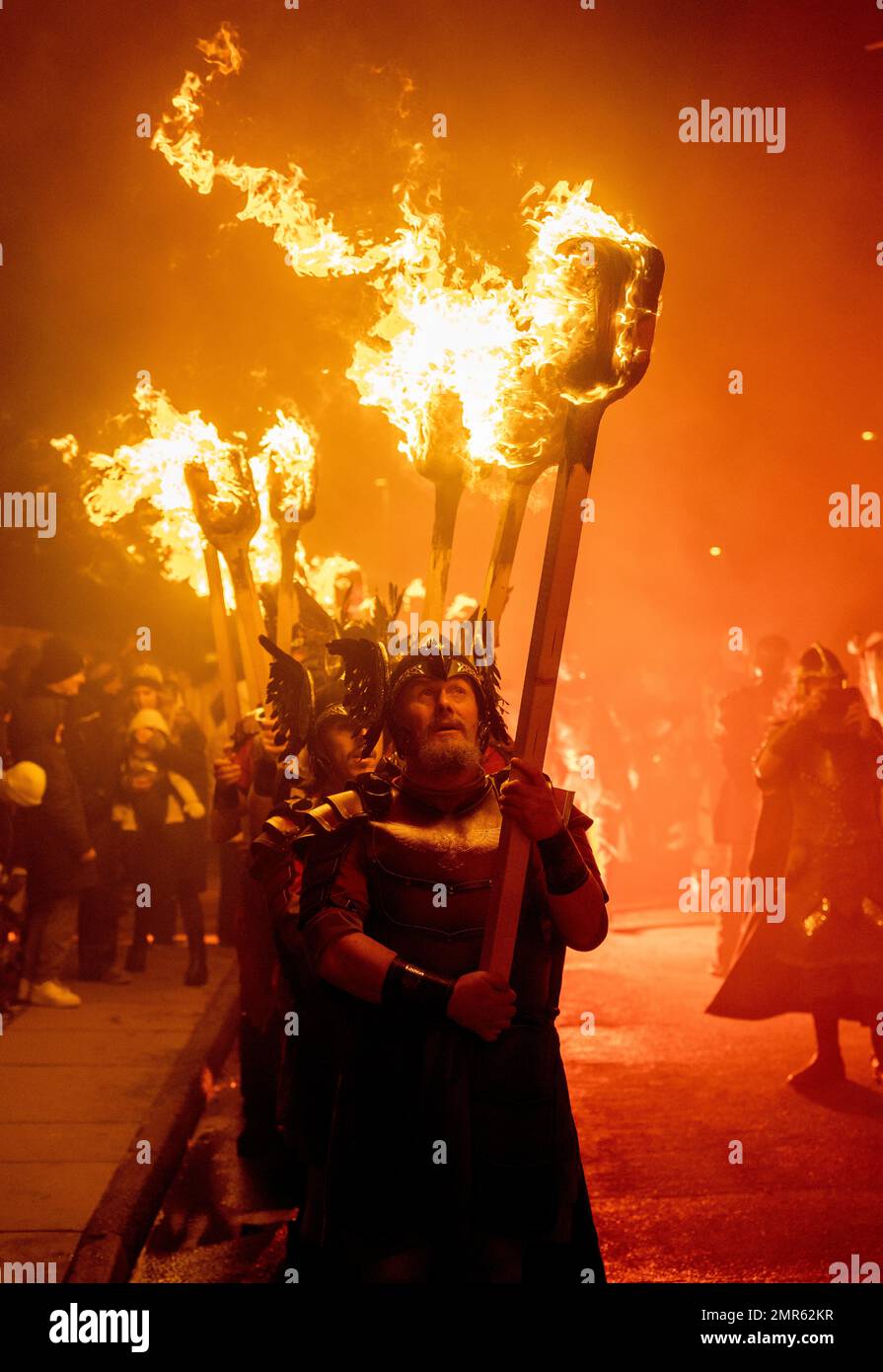 Squad members take part in the torch procession in Lerwick on the ...