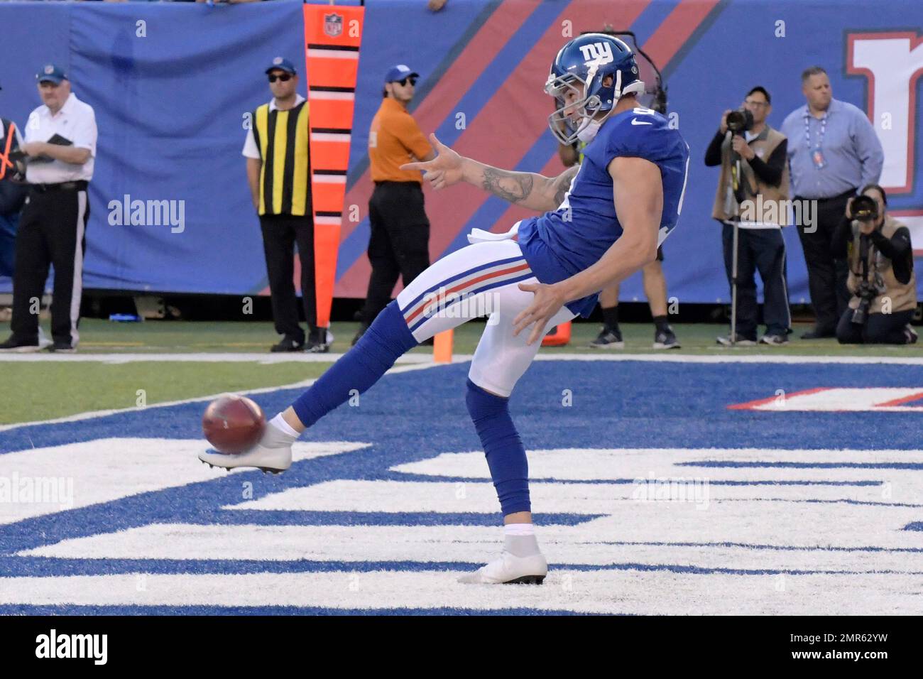 New York Giants punter Brad Wing punts during the first half of an NFL ...