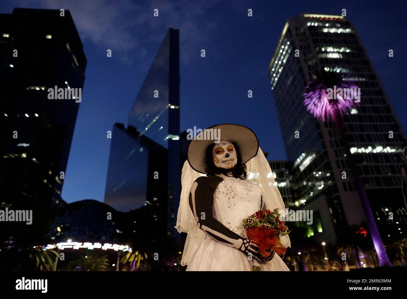 Montserrat Ramirez, dressed as a skeleton bride, poses for pictures ...