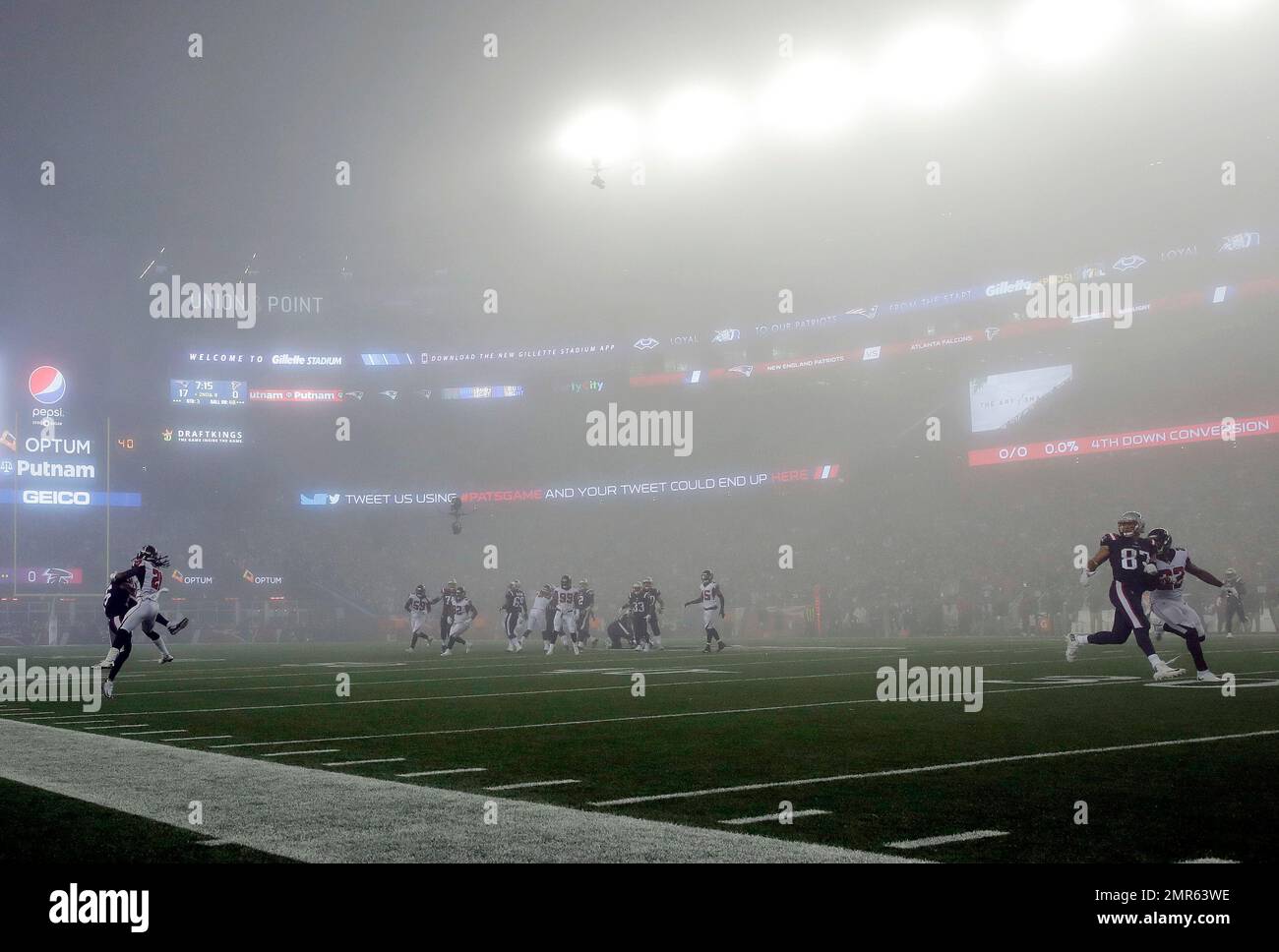 Fog settles over the field during the second half of an NFL football ...