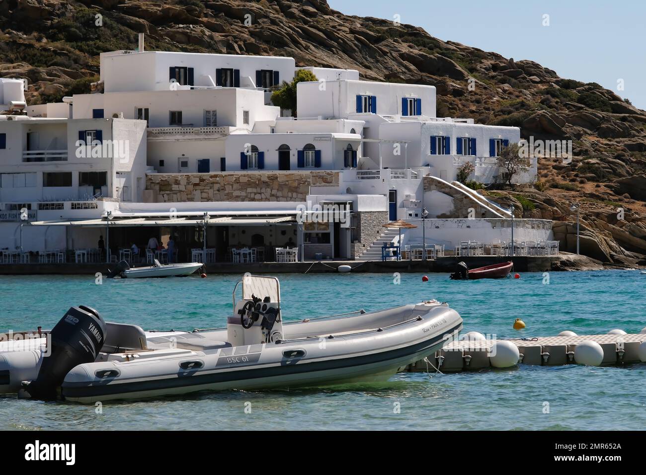 Ios, Greece - June 3 , 2021 : View of a speed boat, a whitewashed hotel ...