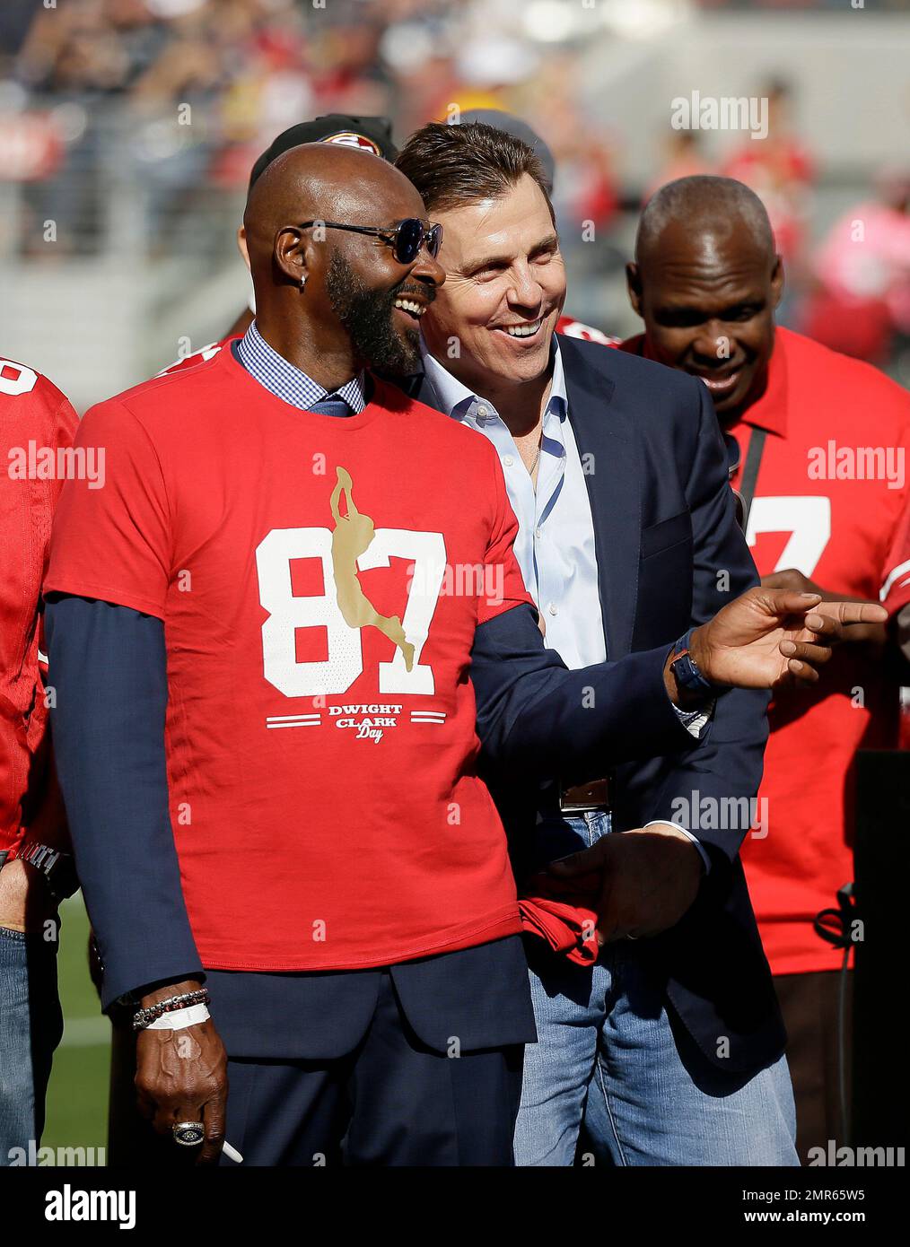 Former football players Jerry Rice, left, and Bill Romanowski smile at ...