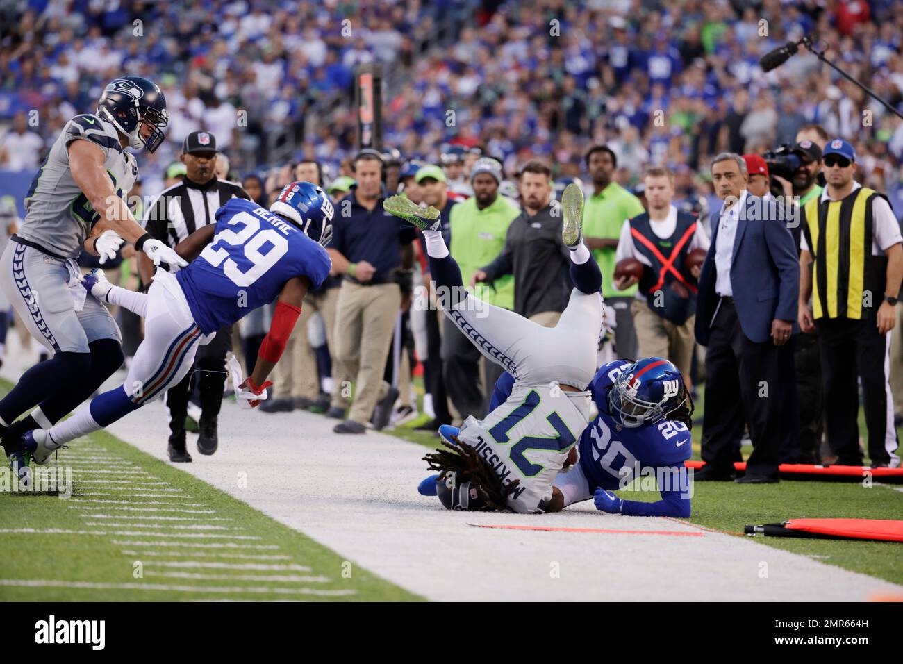 Seattle Seahawks J.D. McKissic jumps over New York Giants' Janoris ...