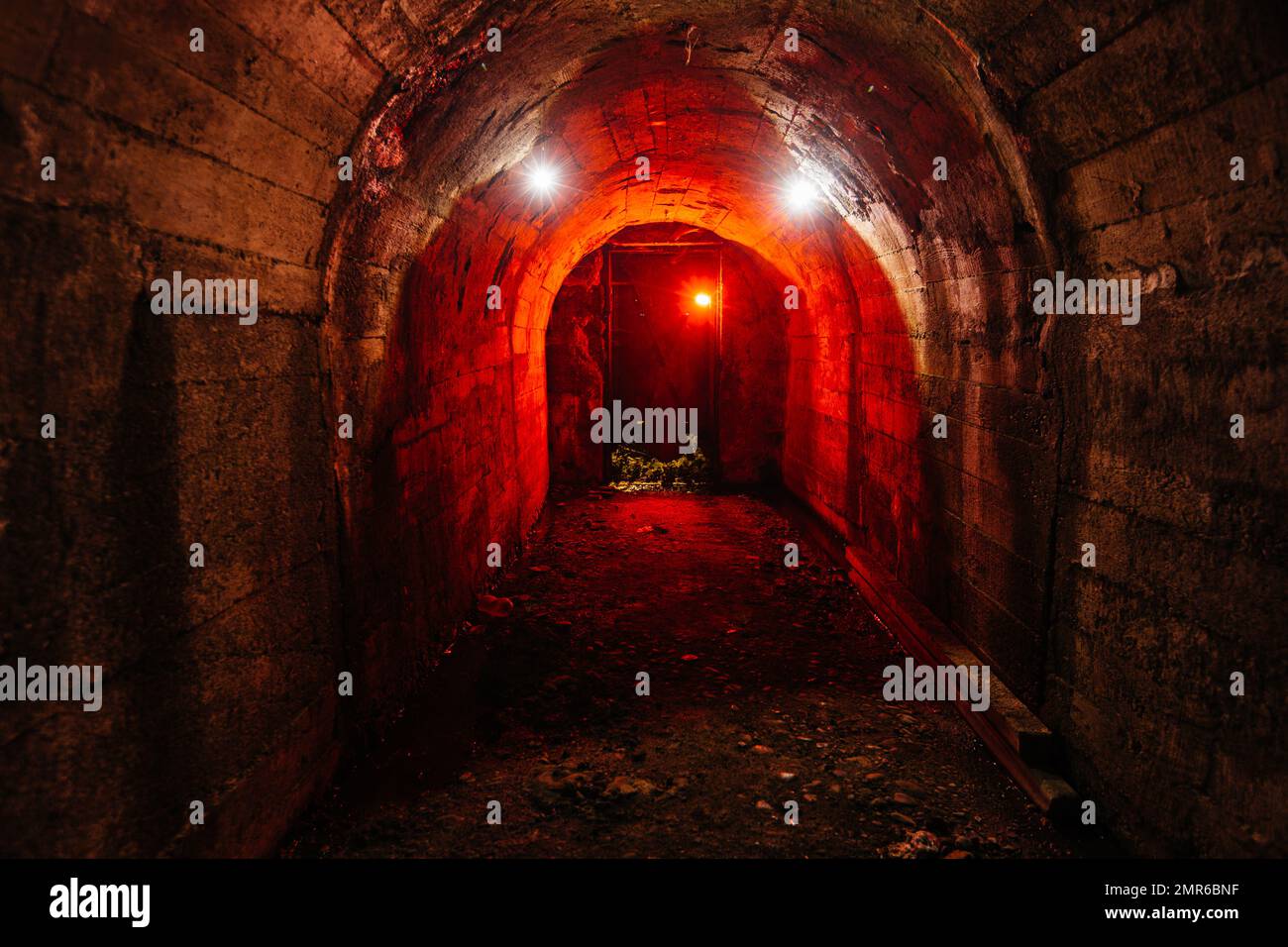 Vaulted tunnel with concrete walls in old abandoned bunker, mine ...