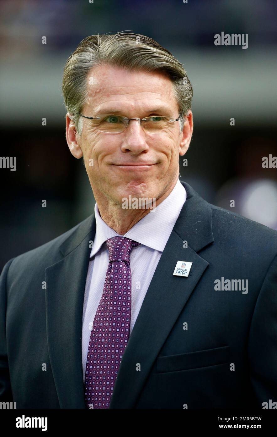 Minnesota Vikings general manager Rick Spielman walks on the field ...