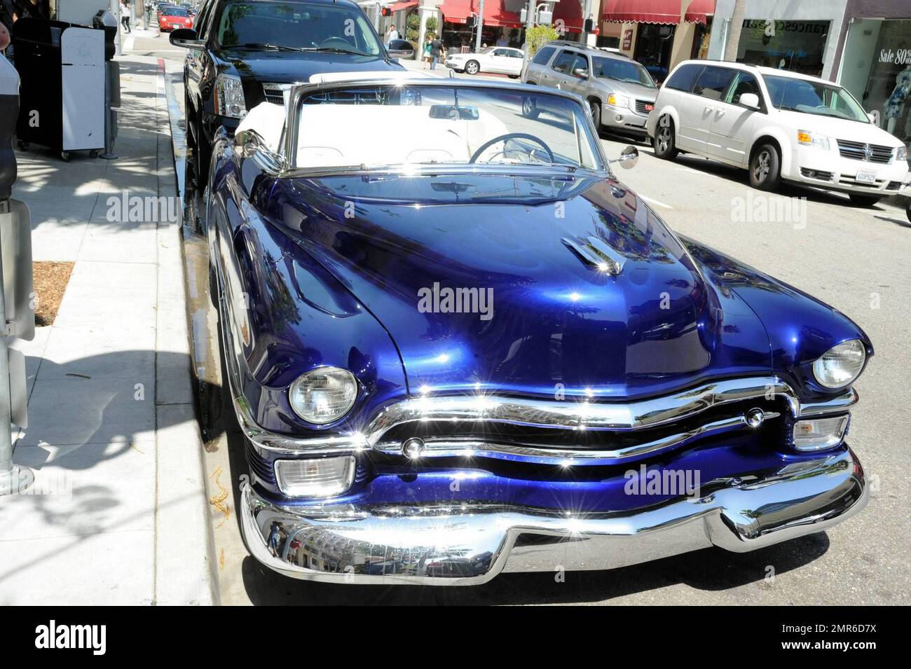 Johnny Hallyday and family enjoy lunch together in Beverly Hills. Johnny had his custom car ...