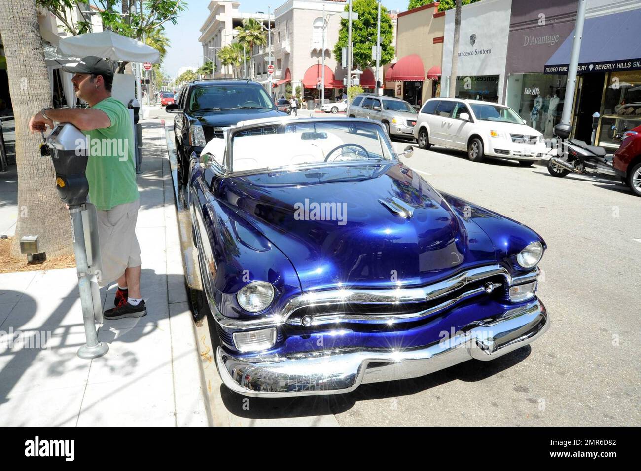 Johnny Hallyday and family enjoy lunch together in Beverly Hills. Johnny had his custom car ...