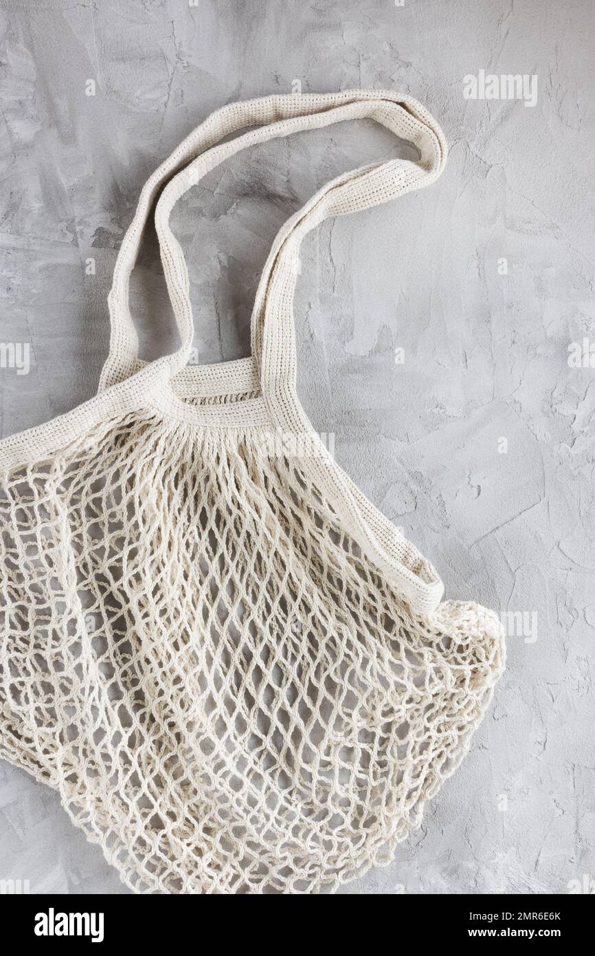 Reusable shopping mesh bag on gray background. Zero waste, no plastic ...