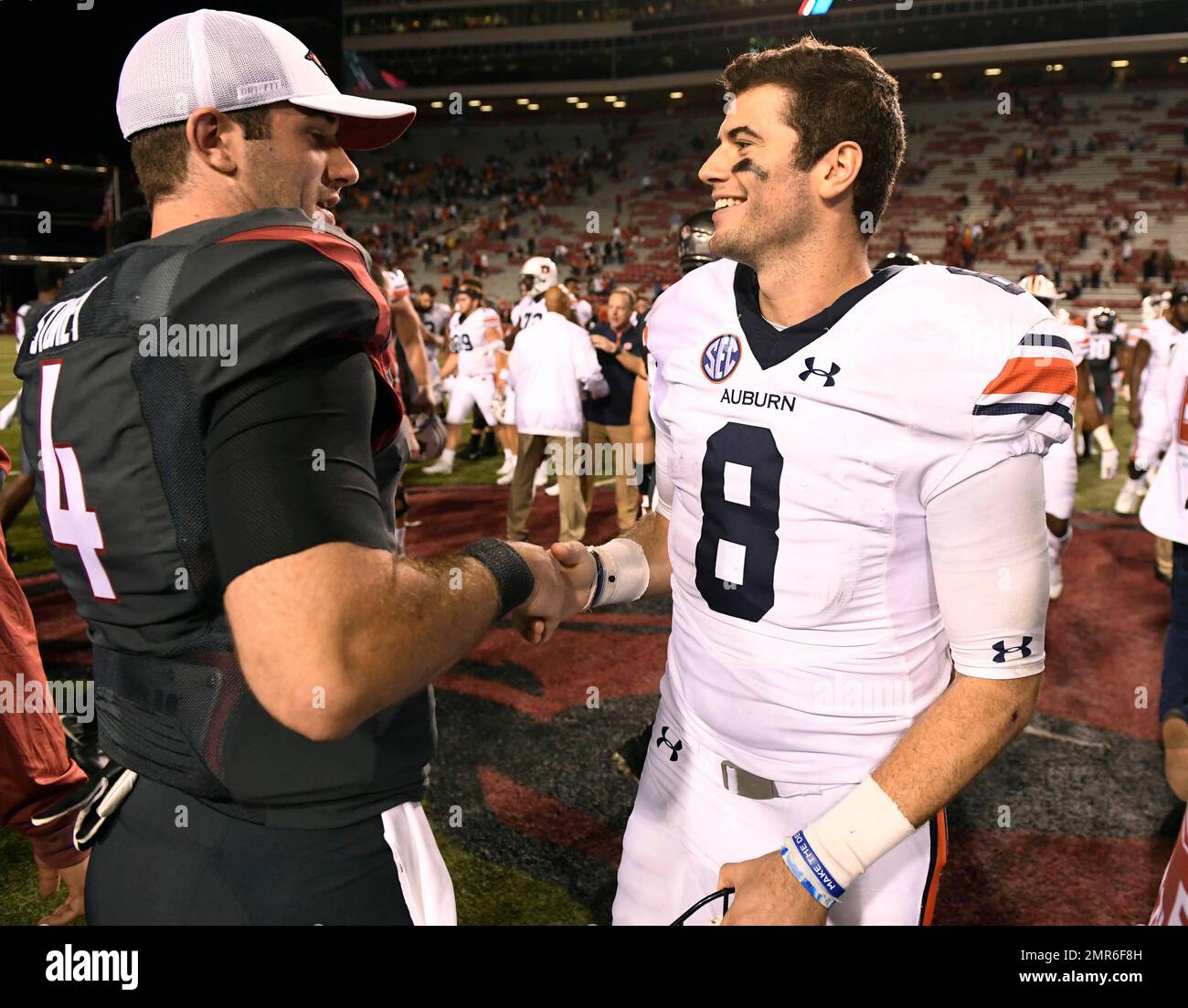 Auburn quarterback Jarrett Stidham, right, shakes hands with Arkansas ...