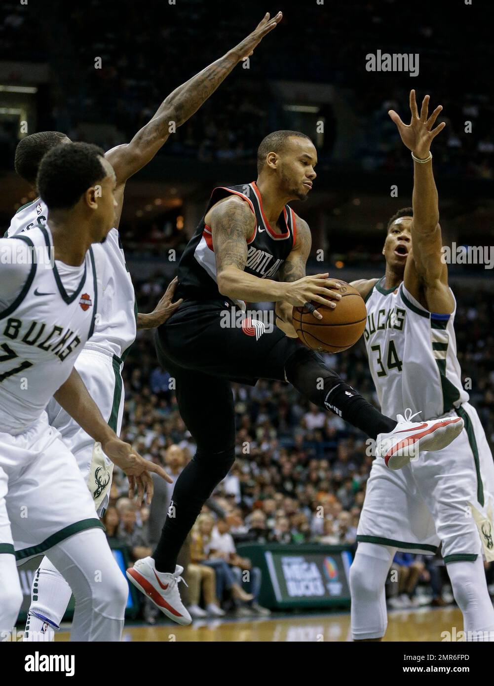 Portland Trail Blazers' Shabazz Napier, center, passes the ball as ...