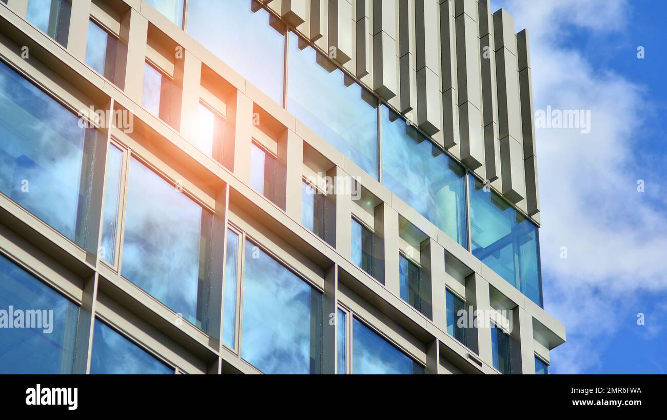 Abstract closeup of the glass-clad facade of a modern building covered ...