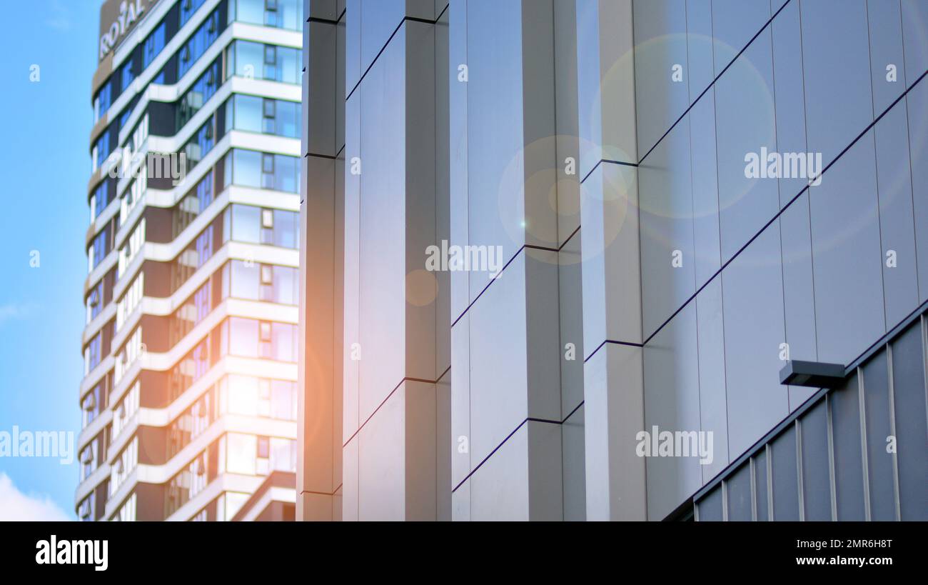 Abstract closeup of the glass-clad facade of a modern building covered ...
