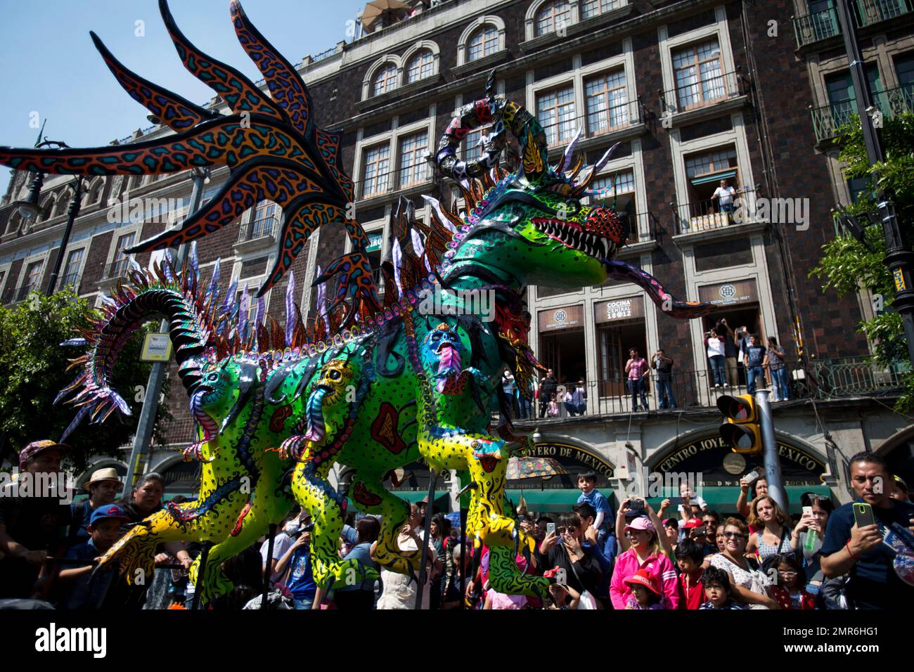 People gather to see a parade of giant "alebrijes," fantastical ...
