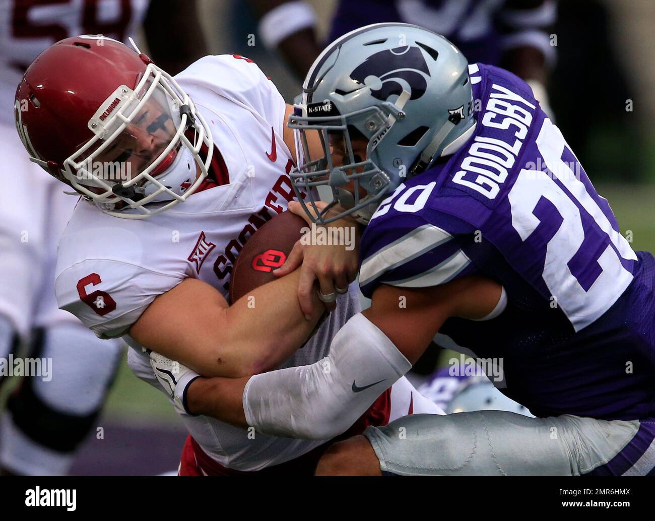Oklahoma quarterback Baker Mayfield (6) is tackled by Kansas State defensive back Denzel Goolsby ...
