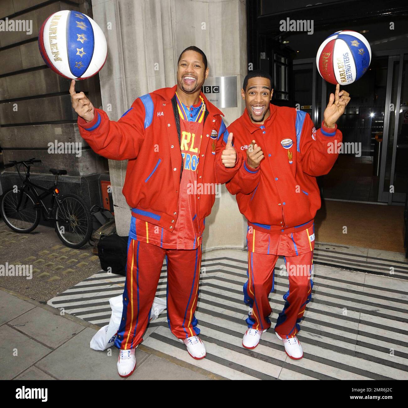 Two members of the world-famous Harlem Globetrotters show off thier ...