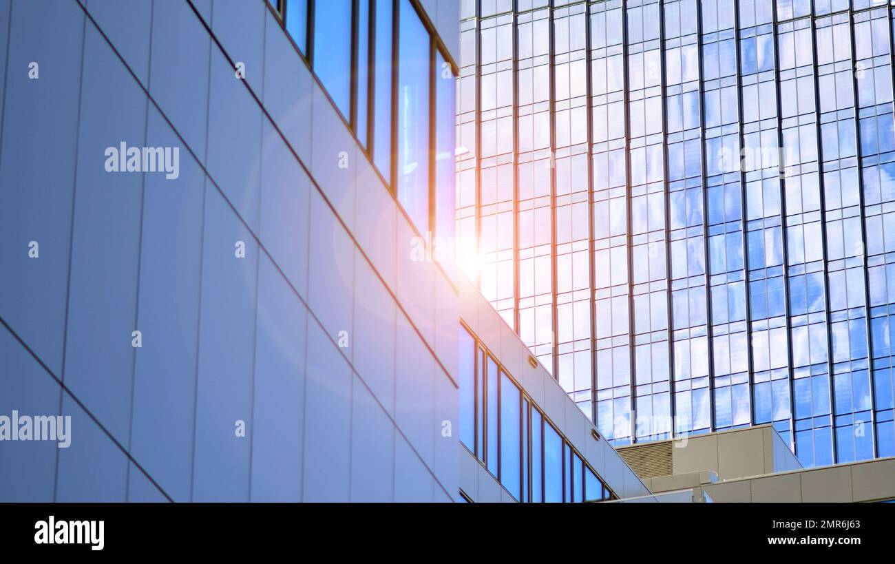 Abstract closeup of the glass-clad facade of a modern building covered ...