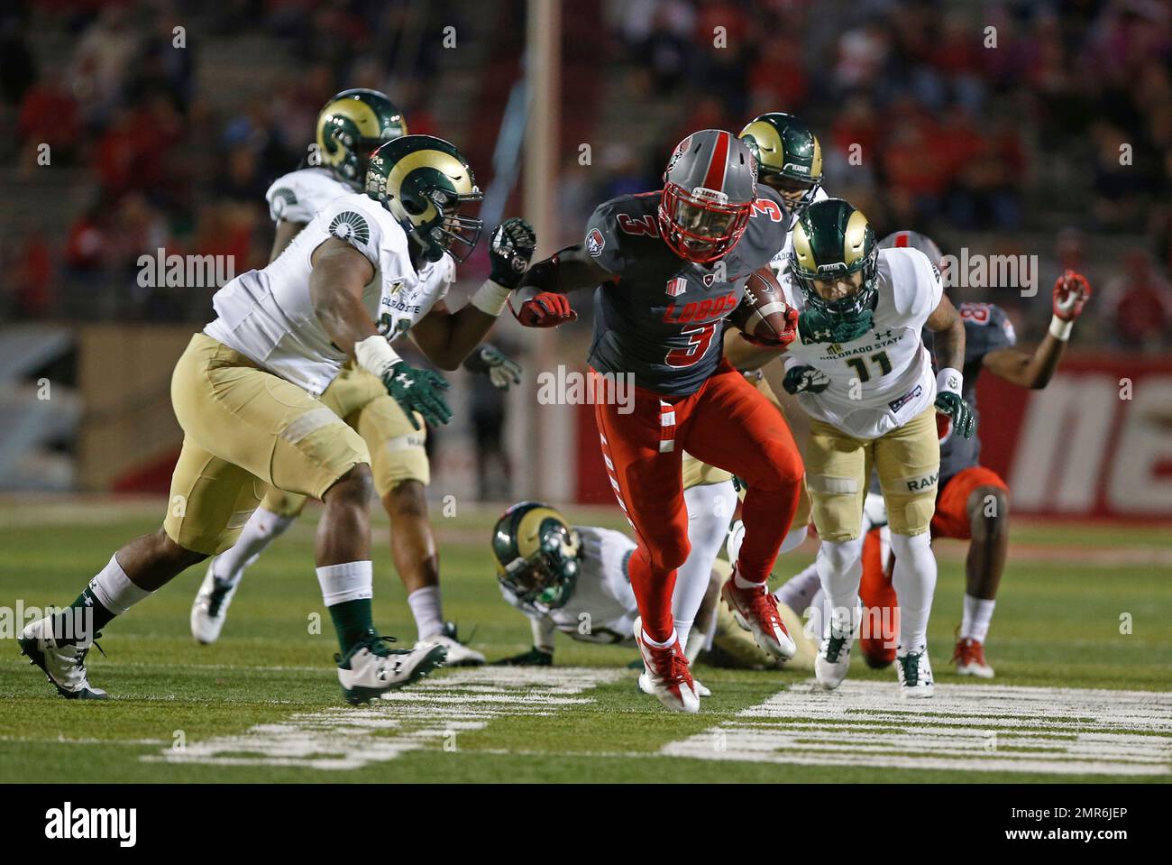 New Mexico running back Richard McQuarley (3) tries to gets past the ...