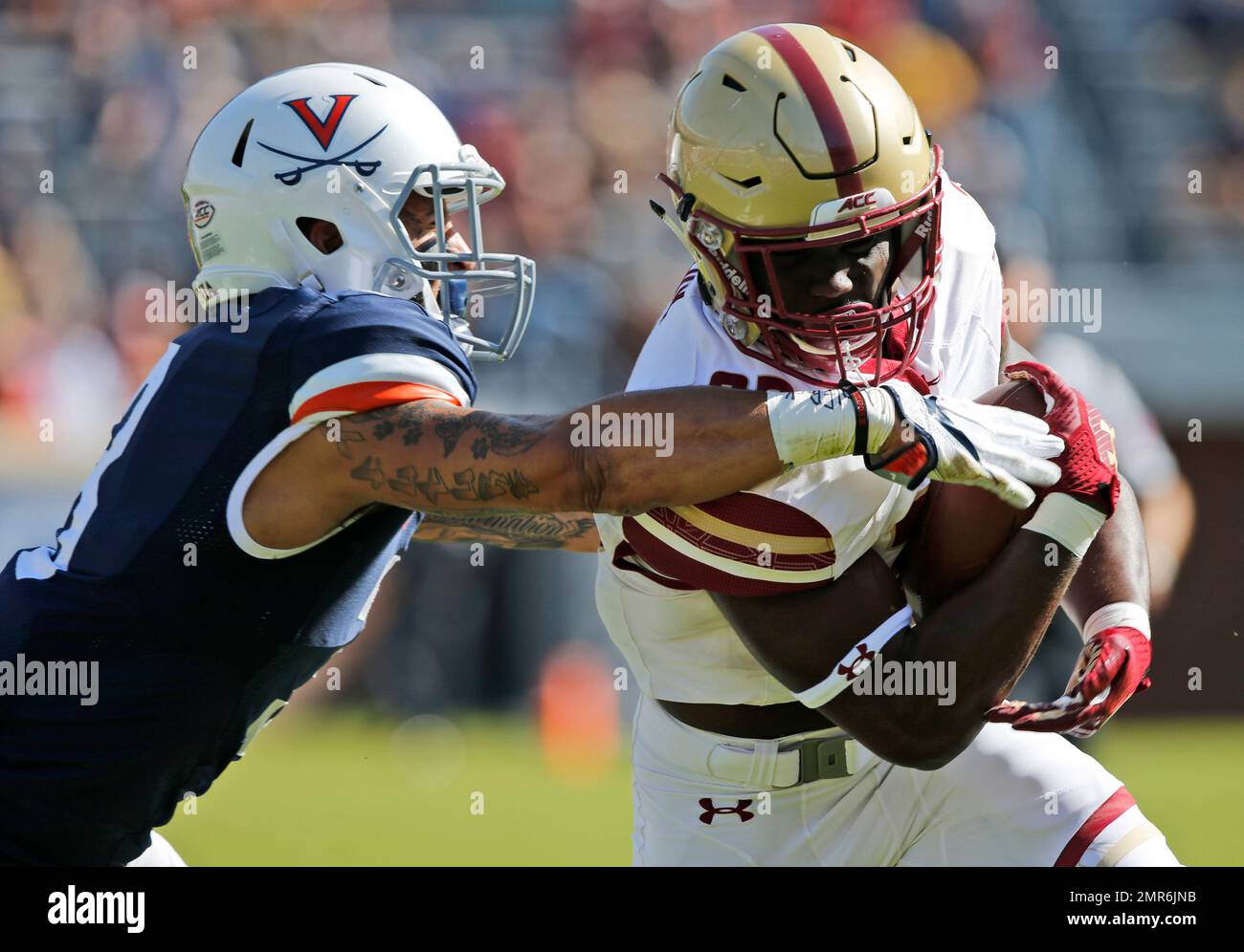 Virginia safety Quin Blanding (3) wraps up Boston College running back ...