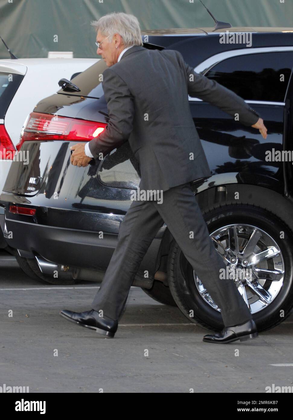 Wearing matching grey, Harrison Ford and his wife Calista Flockhart ...