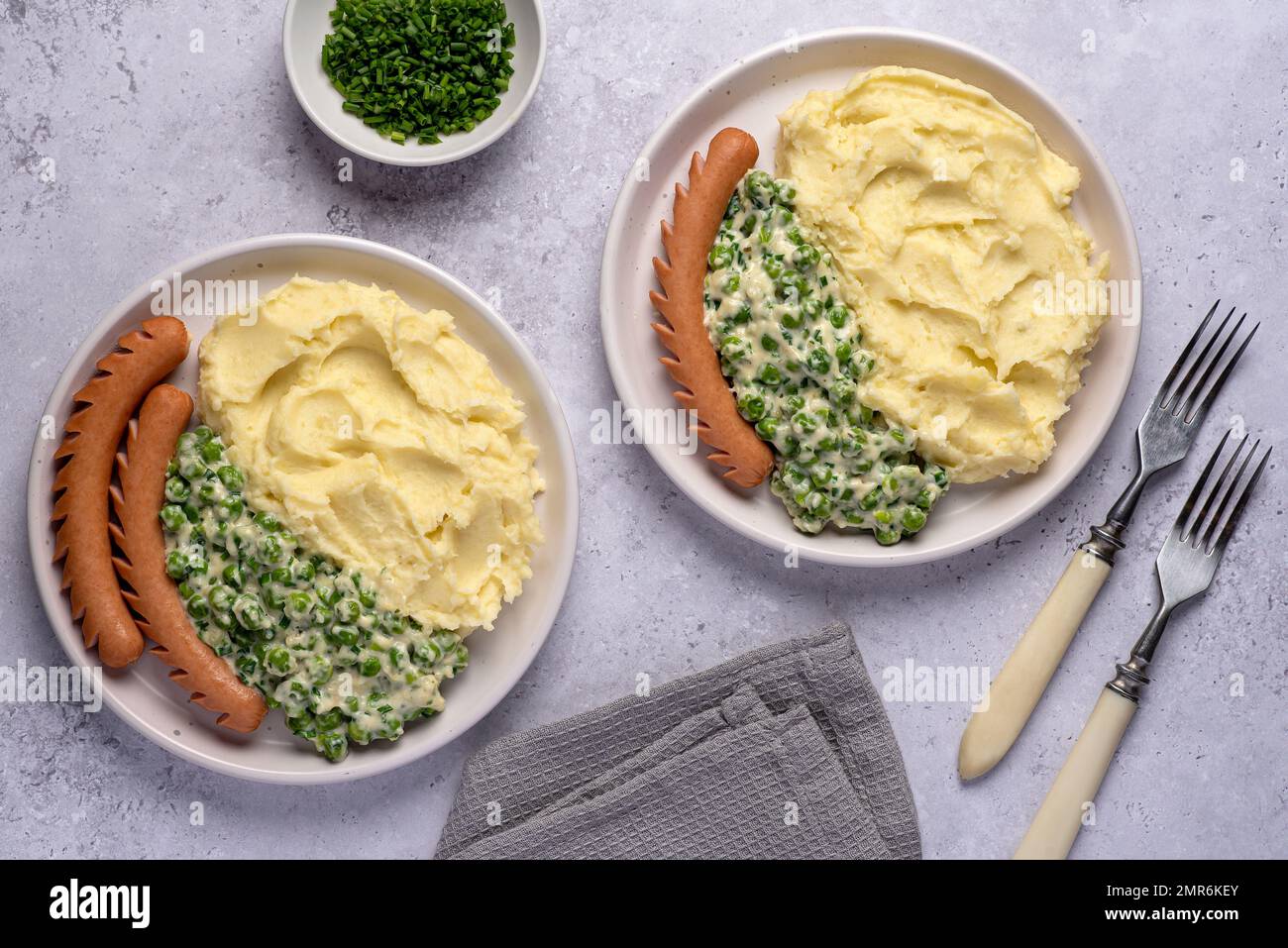 Food photography of mashed potatoes, sausage, green peas, chive, dinner ...