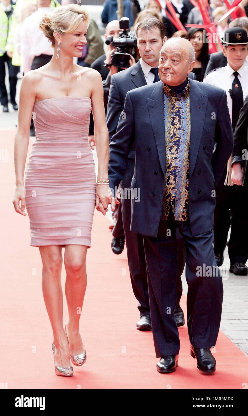 Czech model Eva Herzigova wears a figure hugging pink dress as she ...