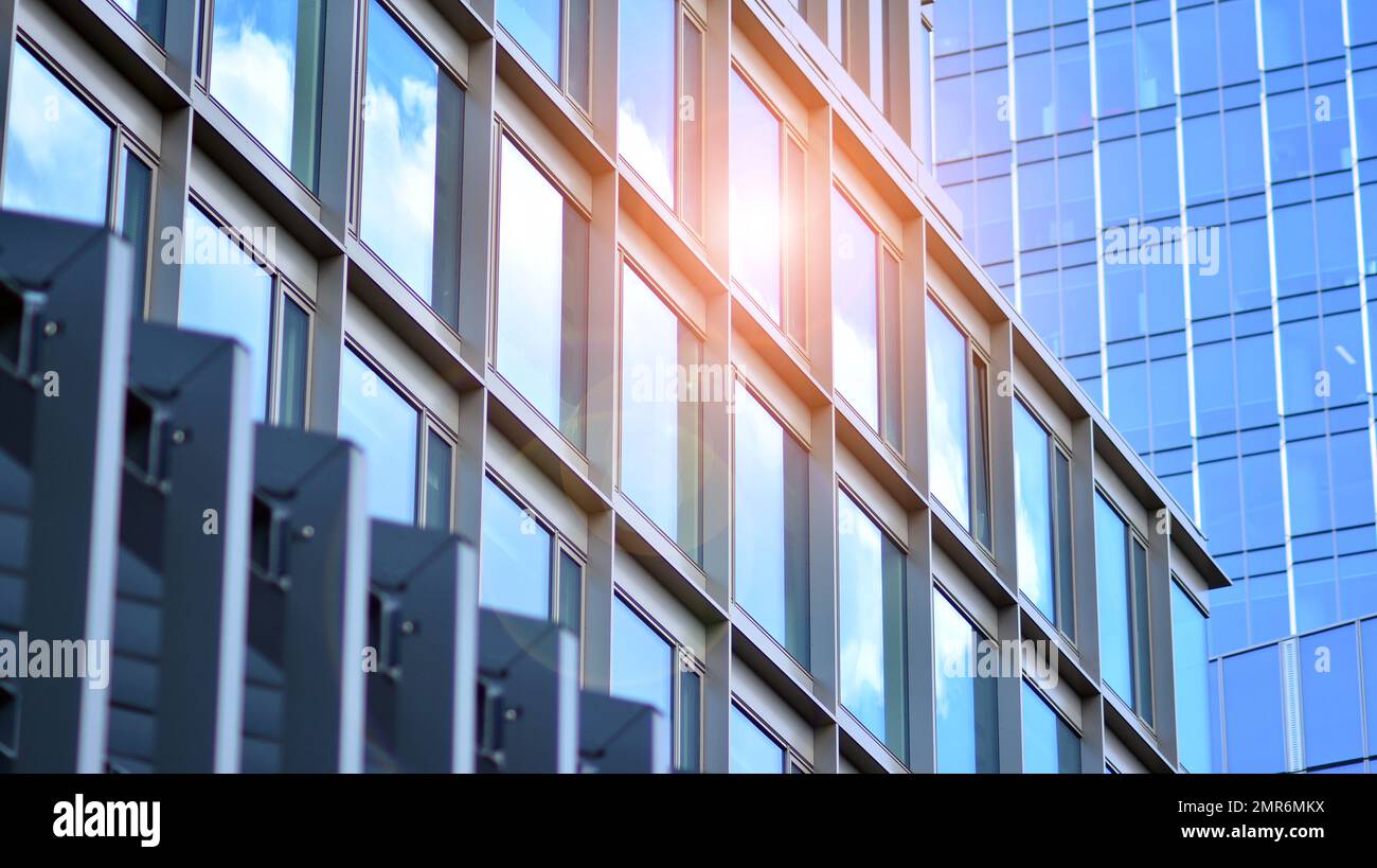 Abstract closeup of the glass-clad facade of a modern building covered ...