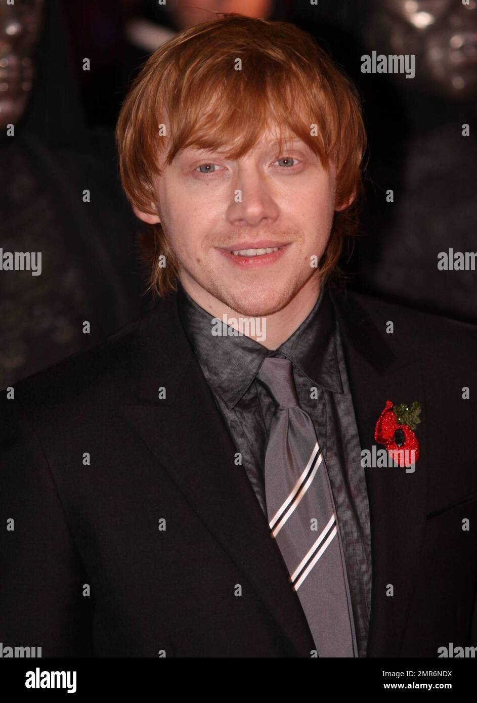 Rupert Grint poses on the red carpet at the world premiere of Warner ...