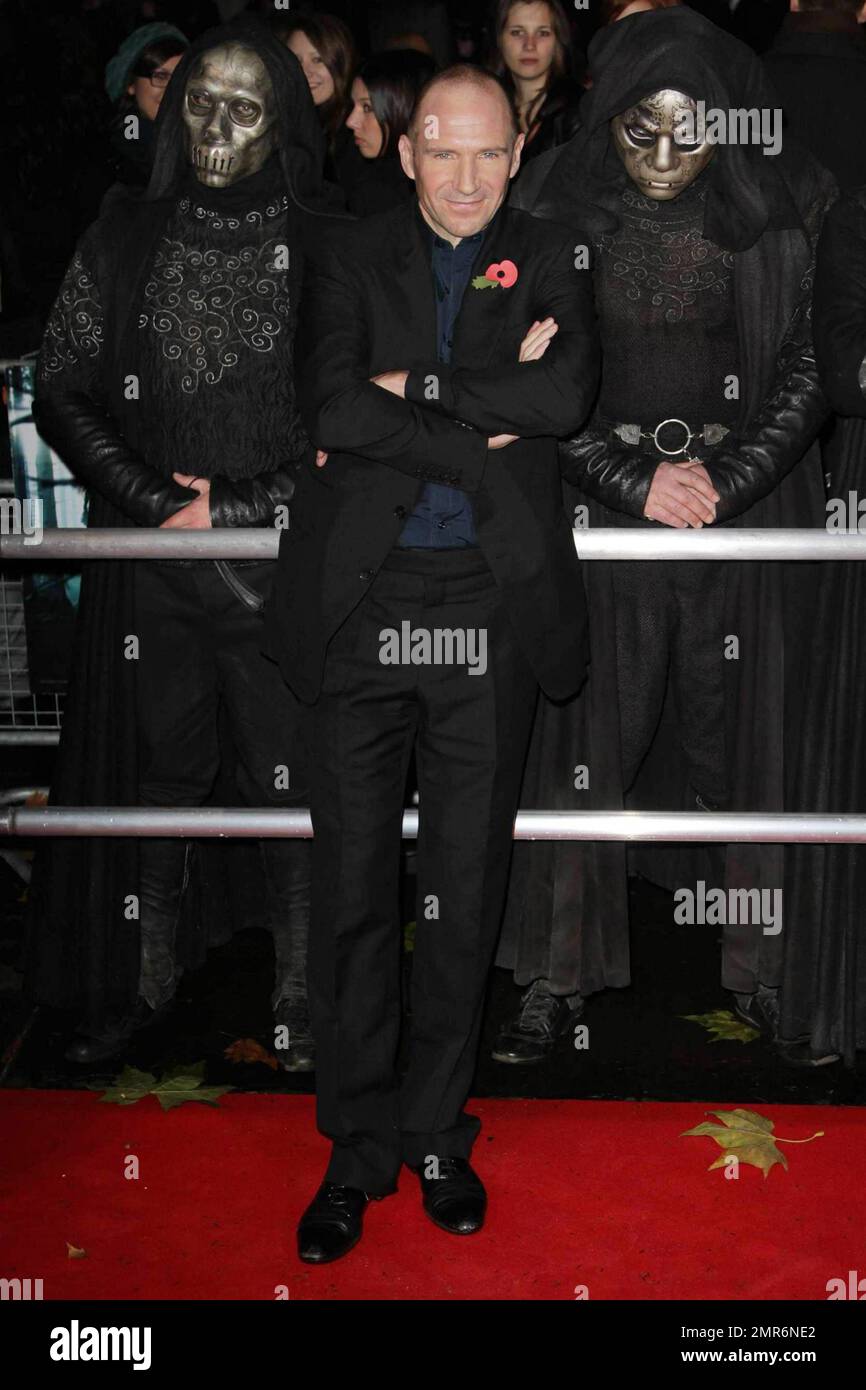 Ralph Fiennes poses on the red carpet at the world premiere of Warner ...