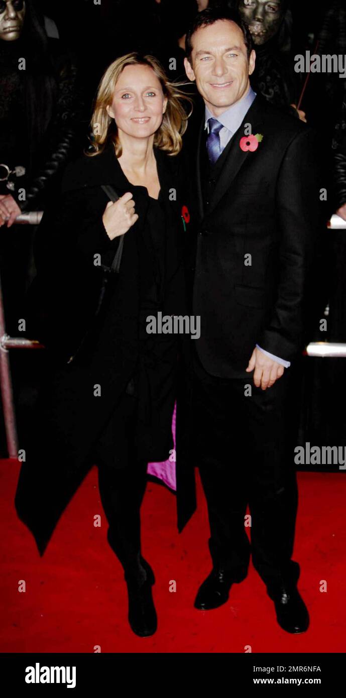 Jason Isaacs and Emma Hewitt pose on the red carpet at the world ...