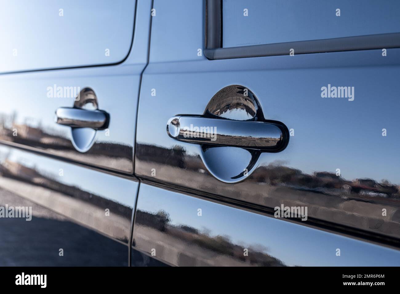Closeup view of handle blue car door Stock Photo - Alamy