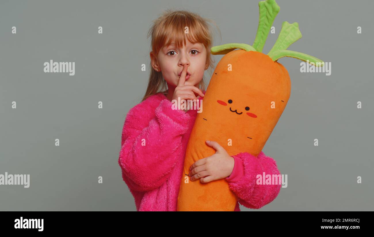 Shh be quiet please. Preteen child girl kid presses index finger to ...