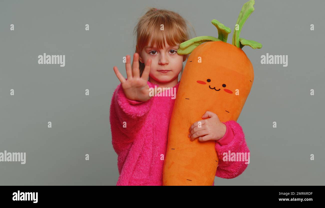 Young preteen child girl kid say No hold palm folded crossed hands in ...