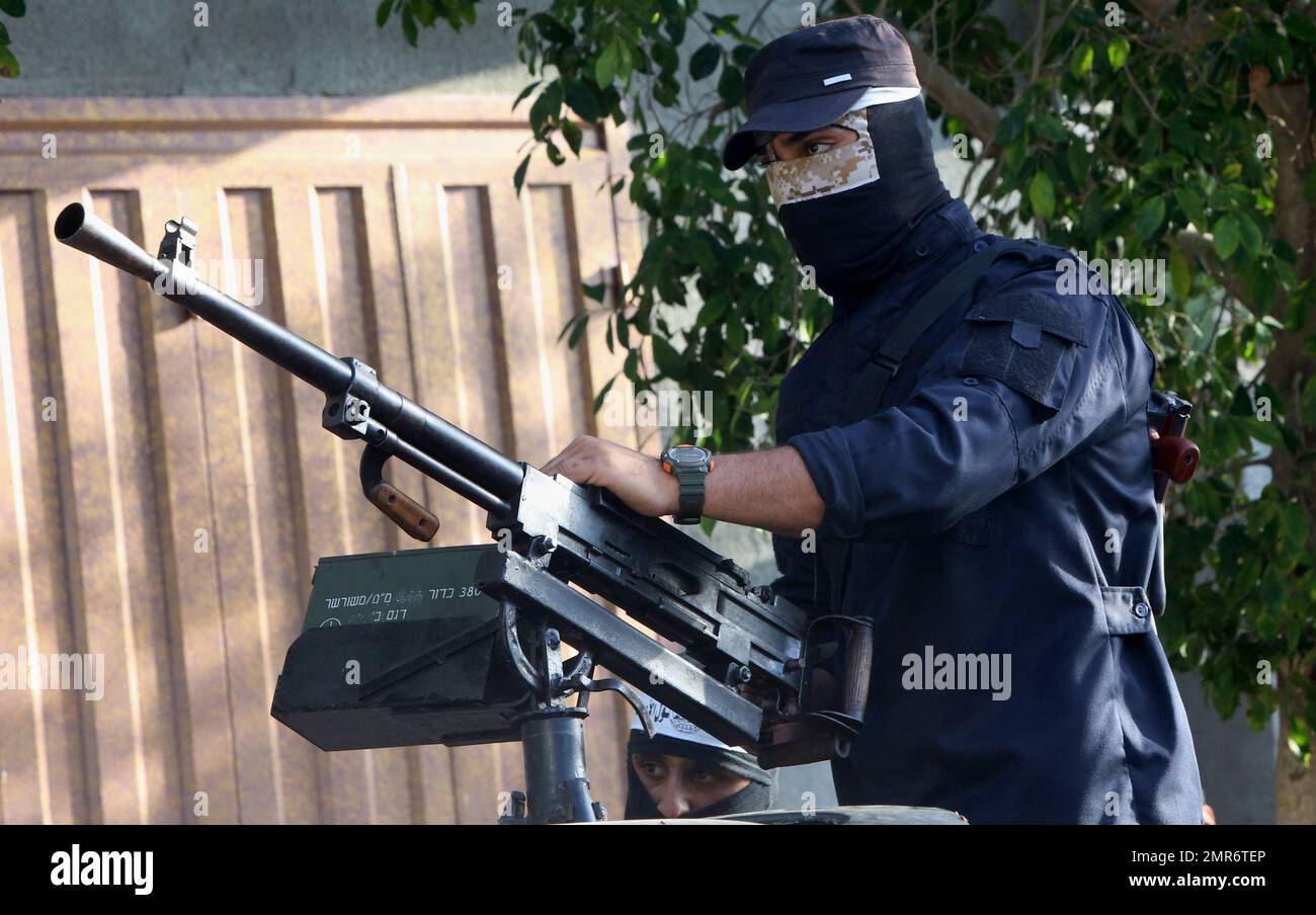 A masked militant of Great Prophet Brigades, the military wing of the ...