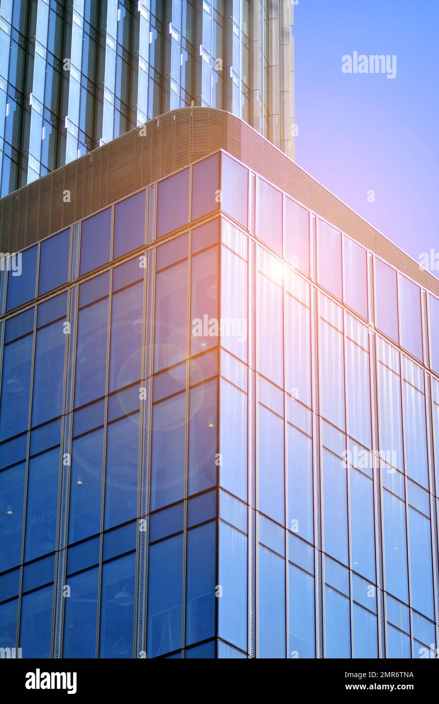 Abstract closeup of the glass-clad facade of a modern building covered ...