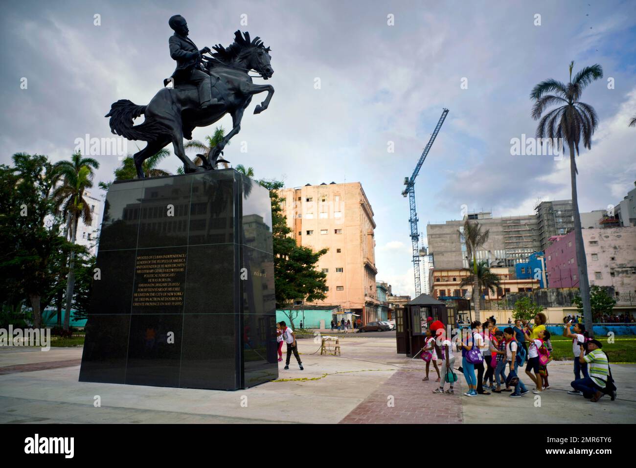 School children look at a bronze statue immortalizing Jose Marti ...