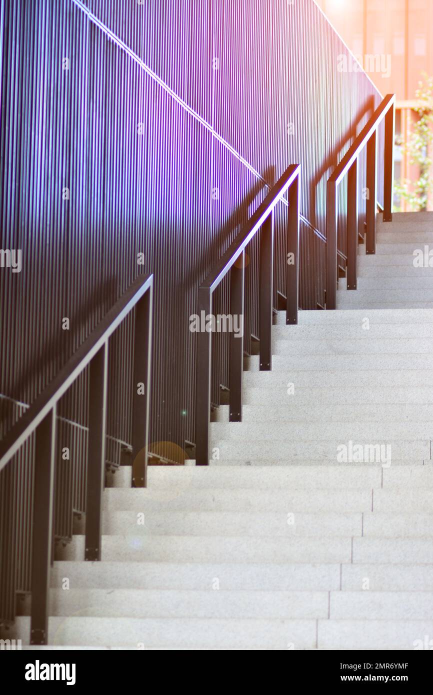 Modern concrete stairs and metal railings outside Stock Photo - Alamy