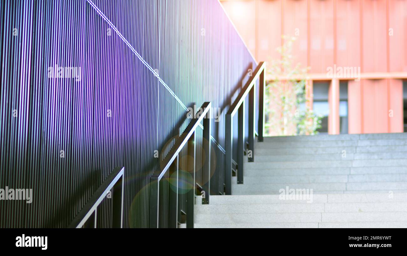 Modern concrete stairs and metal railings outside Stock Photo - Alamy