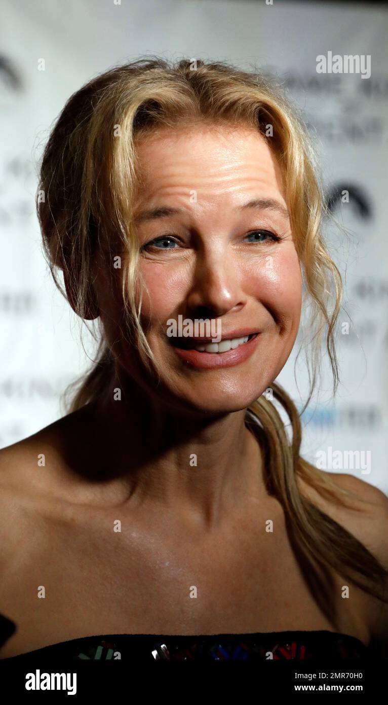 Actress Renée Zellweger speaks to reporters as she arrives for the ...
