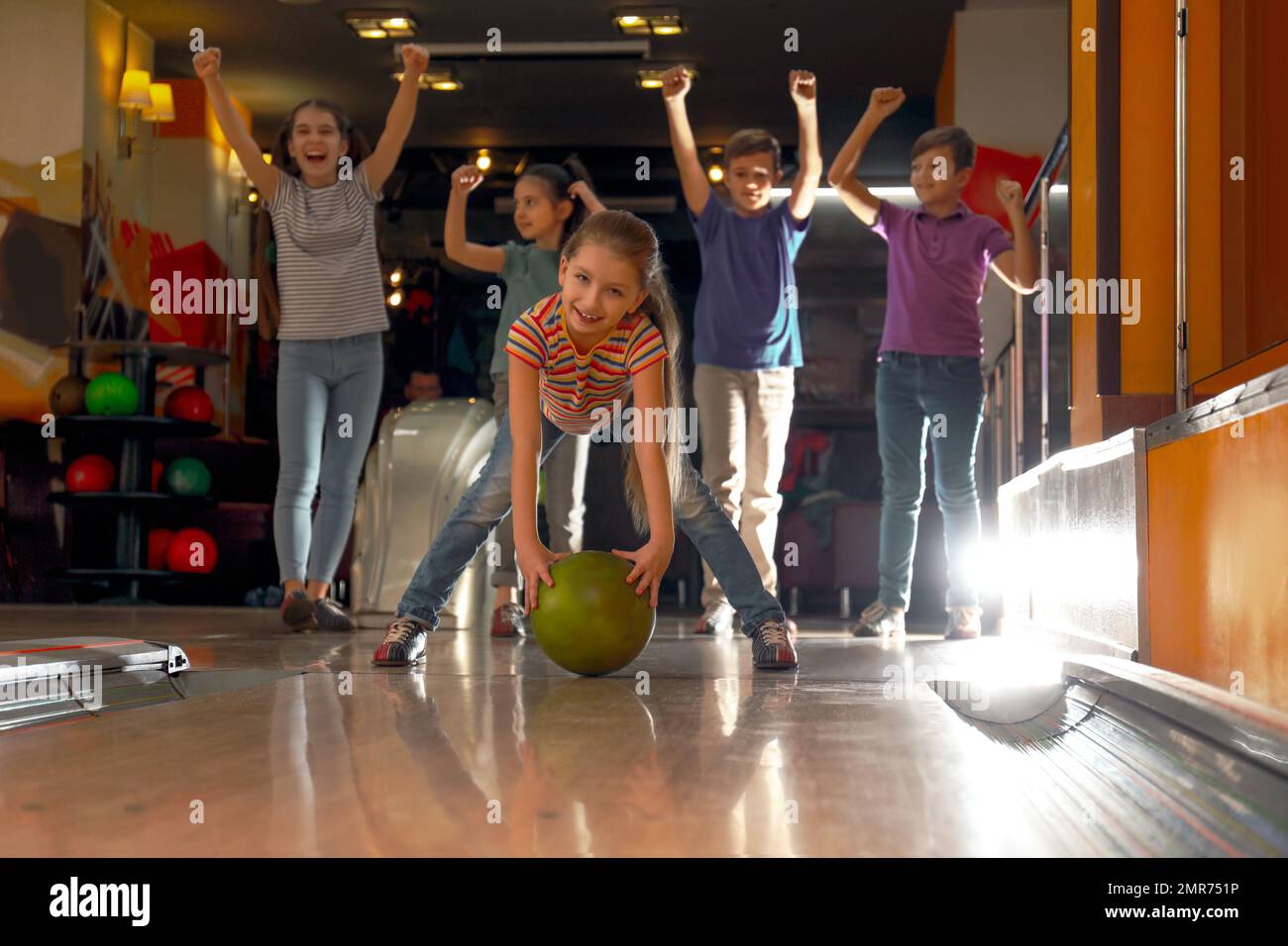 Children throwing ball together hi-res stock photography and images - Alamy