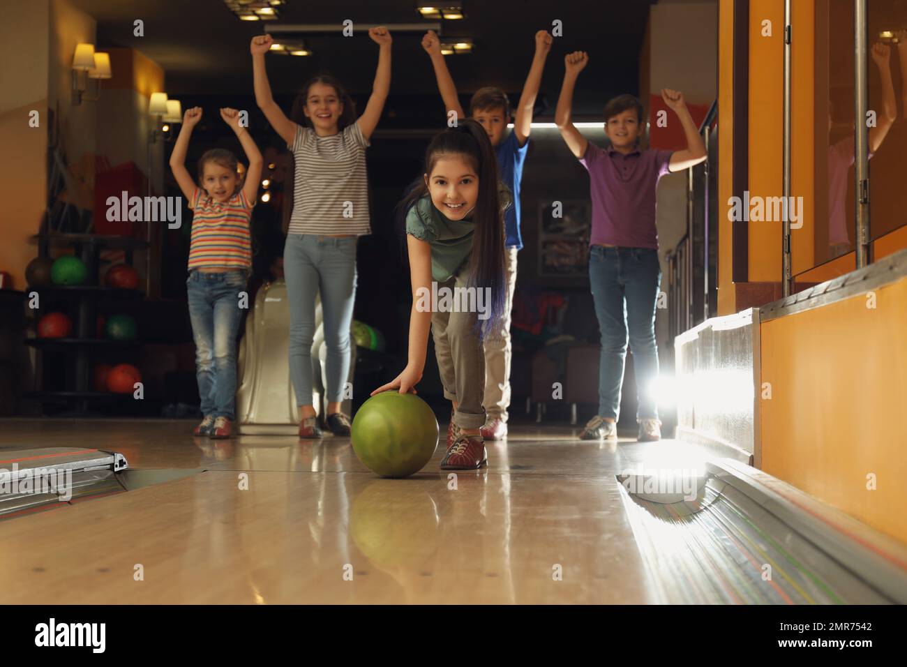 Children throwing ball together hi-res stock photography and images - Alamy