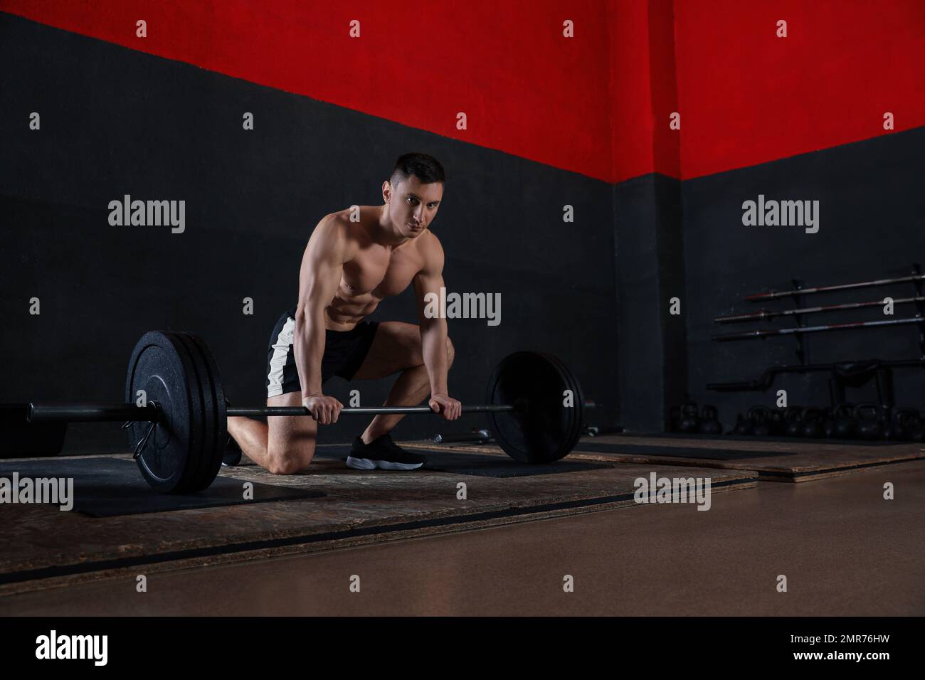 Strong man lifting barbell in hi-res stock photography and images - Alamy