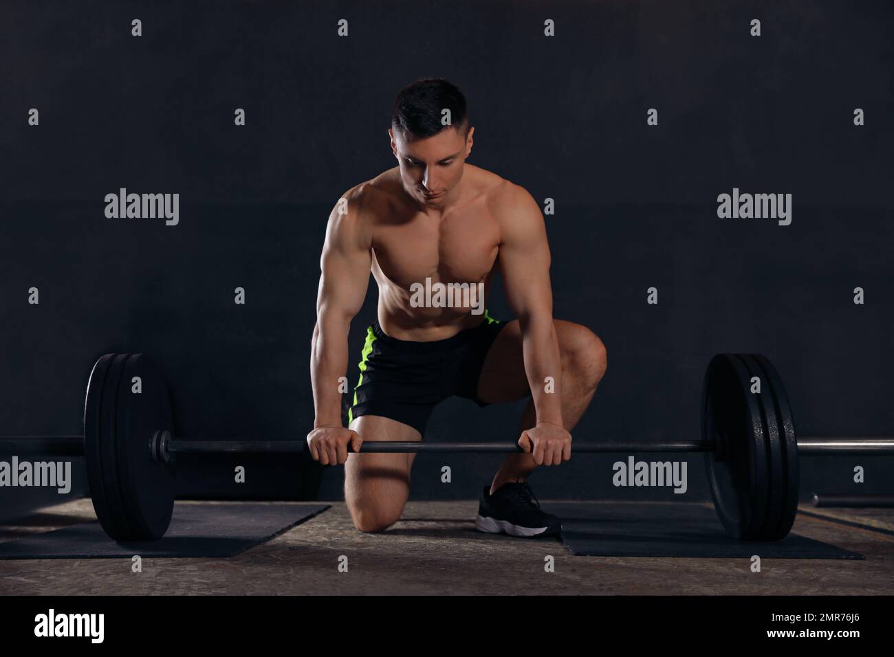 Confident man lifting barbell hi-res stock photography and images - Alamy