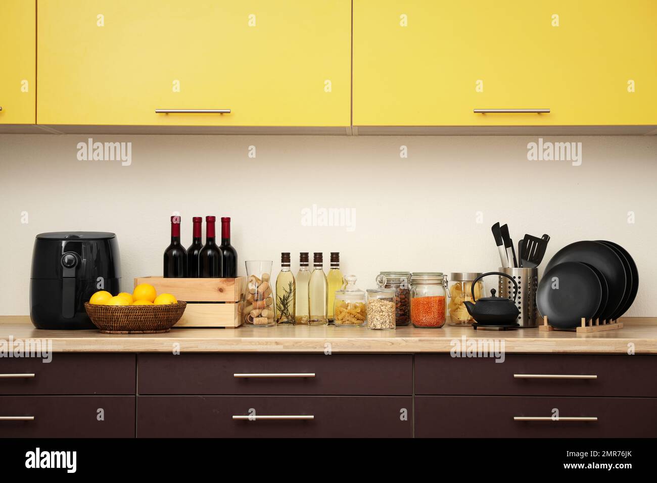 Stylish kitchen interior with wooden countertop and wall cabinets Stock ...