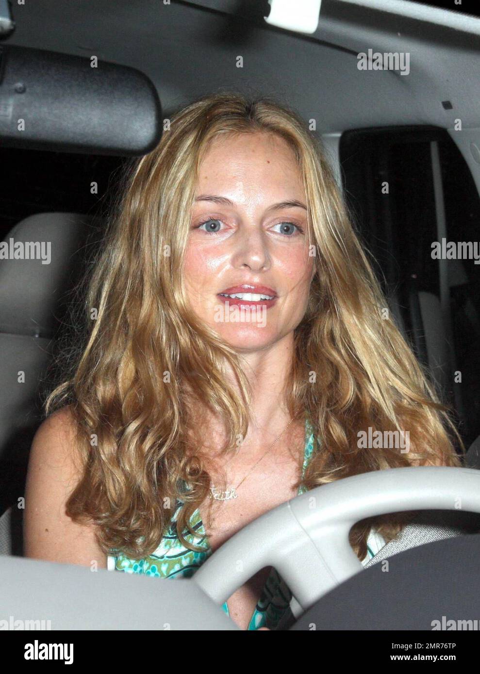 Actress Heather Graham slips out the back of the restaurant Koi to ...