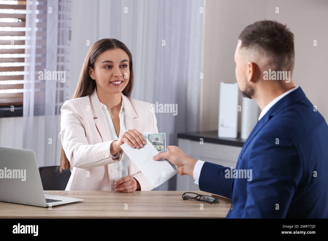 Man giving bribe smiling hi-res stock photography and images - Alamy
